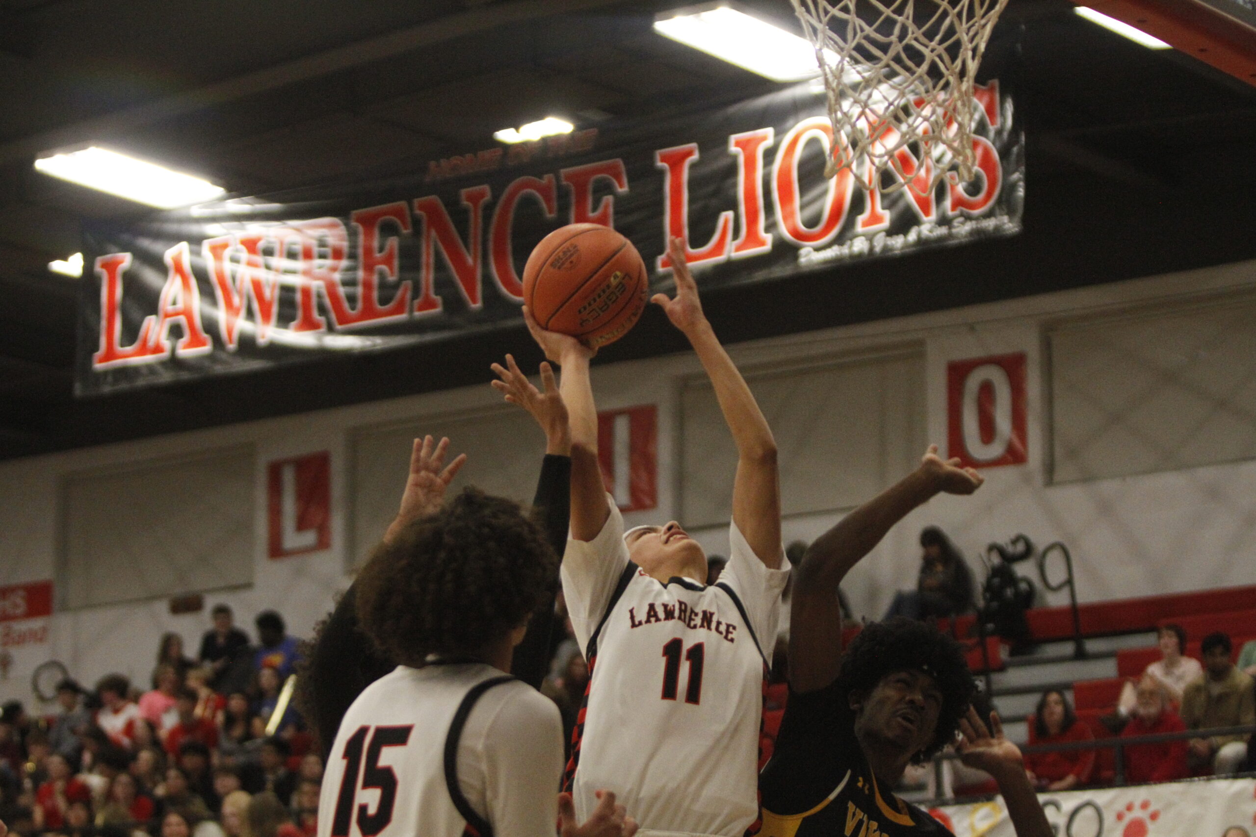 Lawrence boys, girls basketball win home doubleheader against Shawnee ...